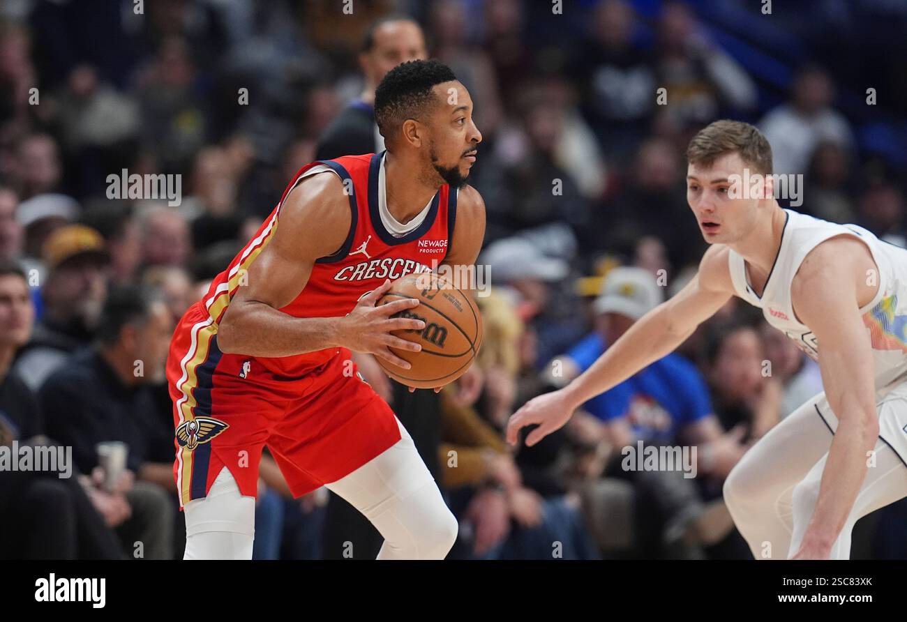 New Orleans Pelicans guard CJ McCollum, left, looks to pass the ball as ...