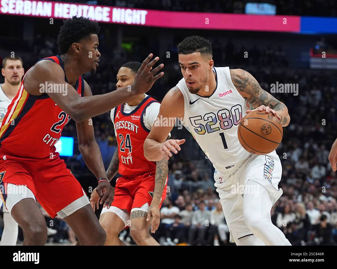 Denver Nuggets forward Michael Porter Jr., right, drives to the basket ...