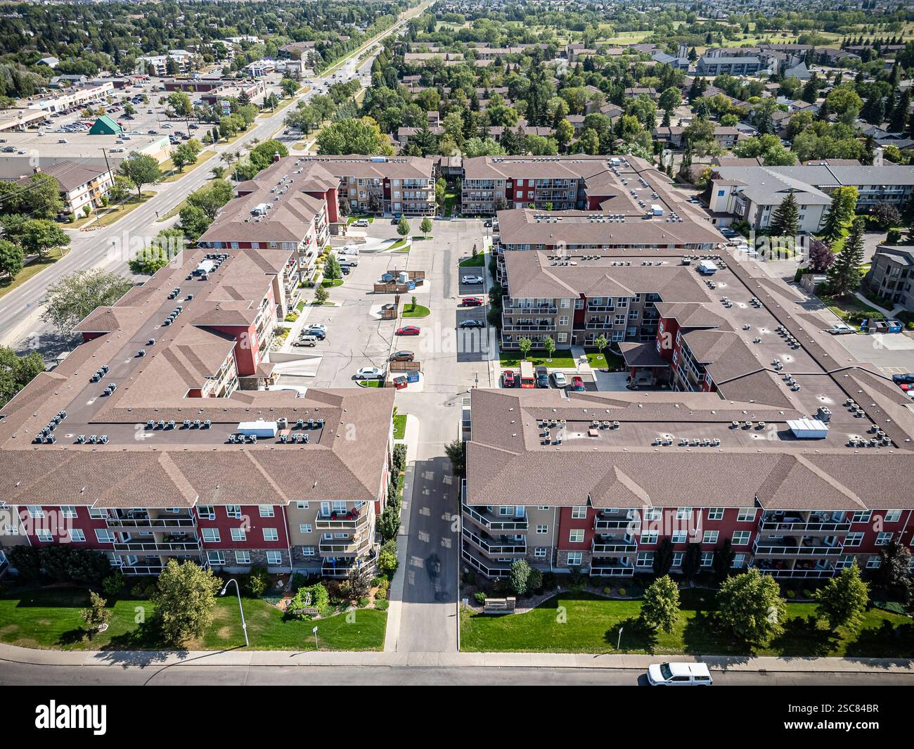 Large apartment complex with many buildings and a lot of parking spaces ...