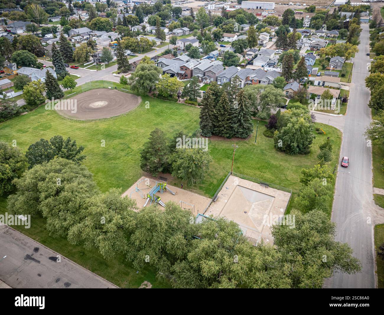 Park with a baseball diamond and a playground. The park is surrounded ...