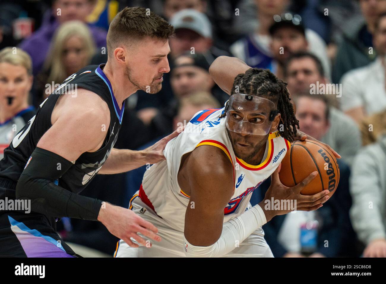 Utah Jazz center Micah Potter (25) guards Golden State Warriors forward ...