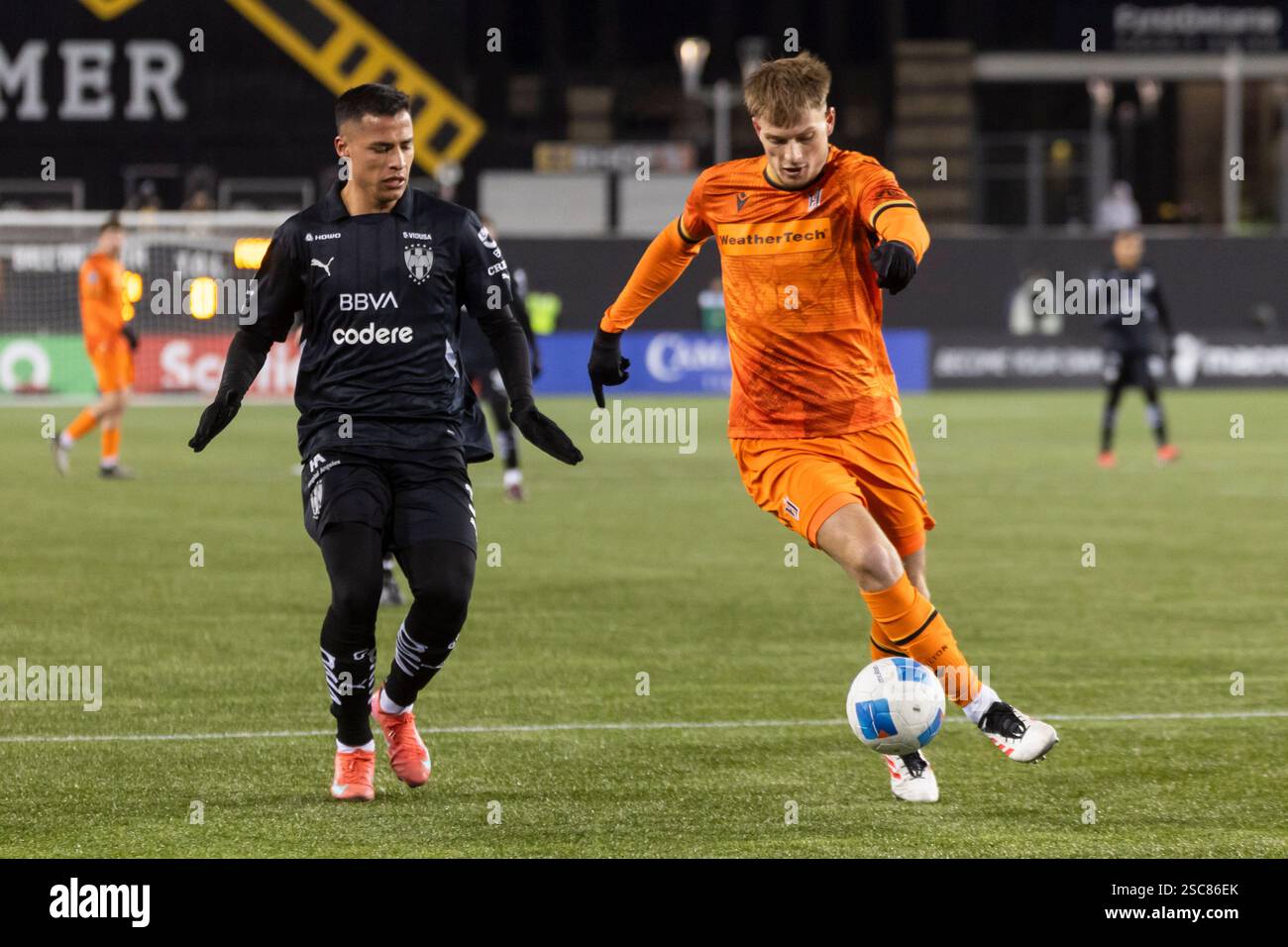 Hamilton Forge FC defender Dan Nimick (right) moves the ball past C.F ...