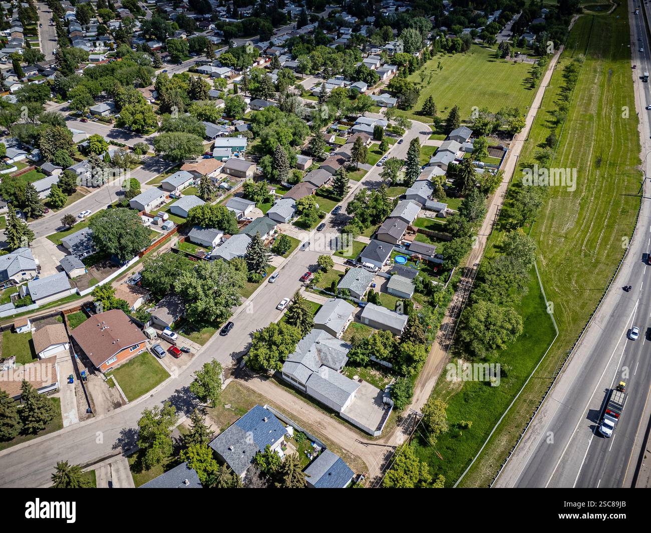 Residential area with houses and a road. The houses are small and the ...
