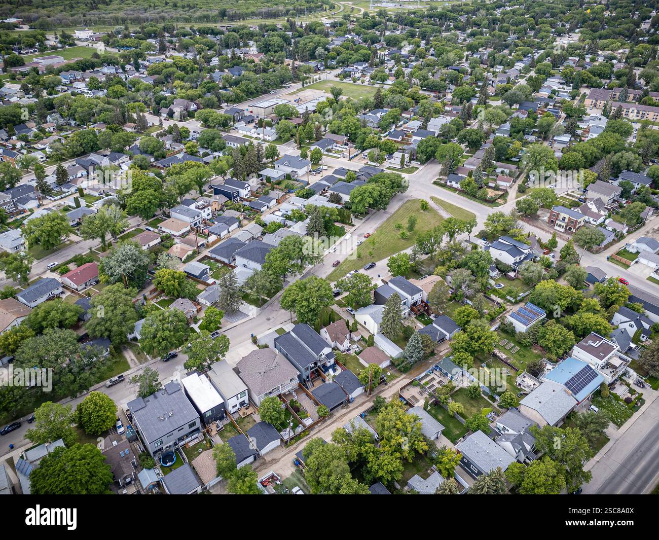 Residential area with many houses and trees. The houses are mostly ...