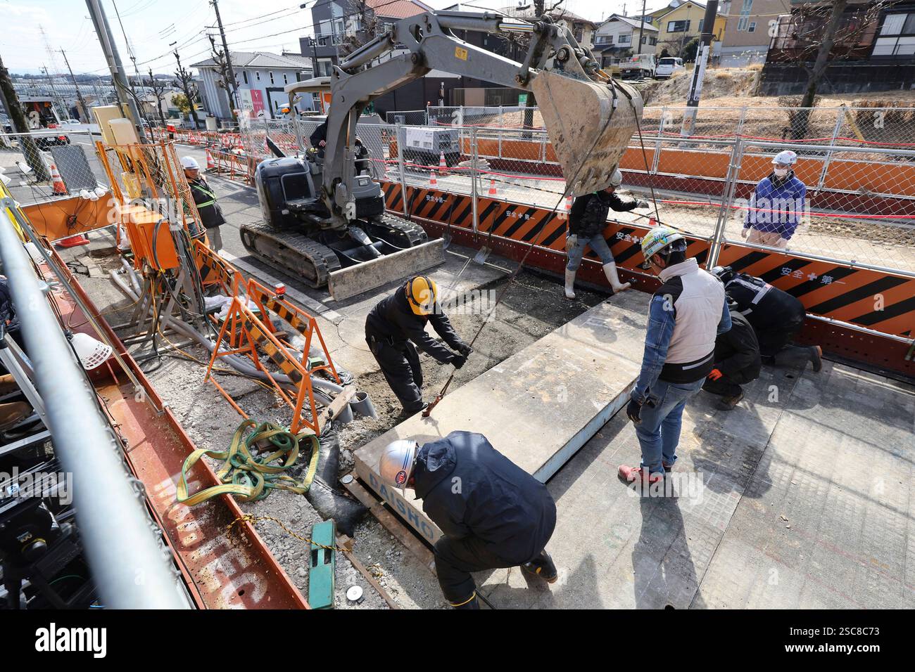 A photo shows the site of water pipe construction where the road ...
