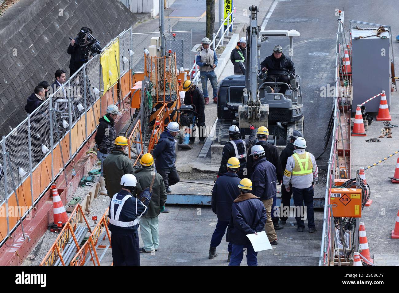 A photo shows the site of water pipe construction where the road ...