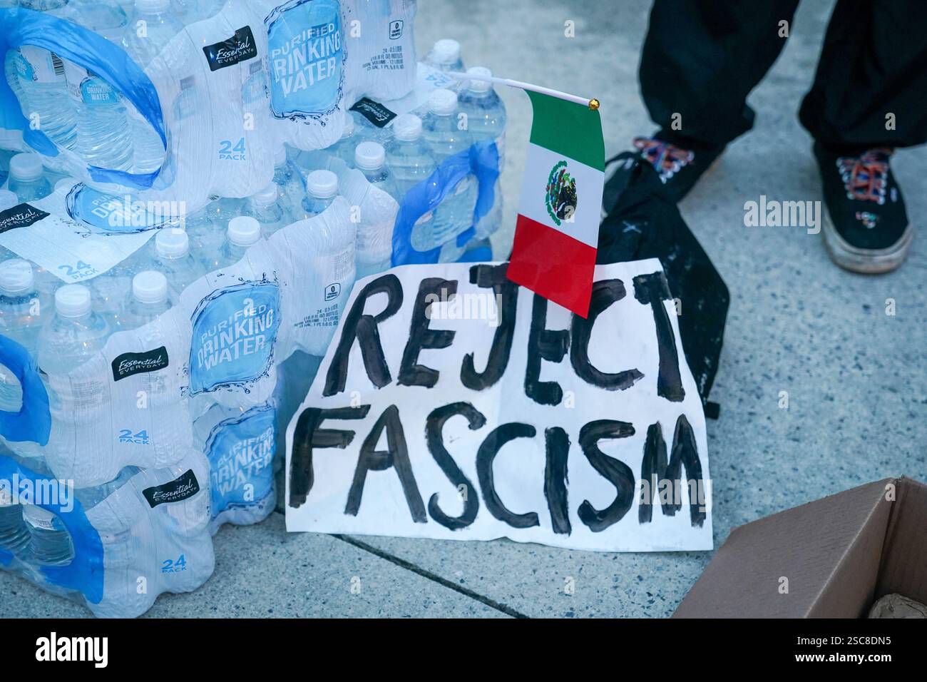 Demonstrators hold protest signs against fascism outside the Georgia ...