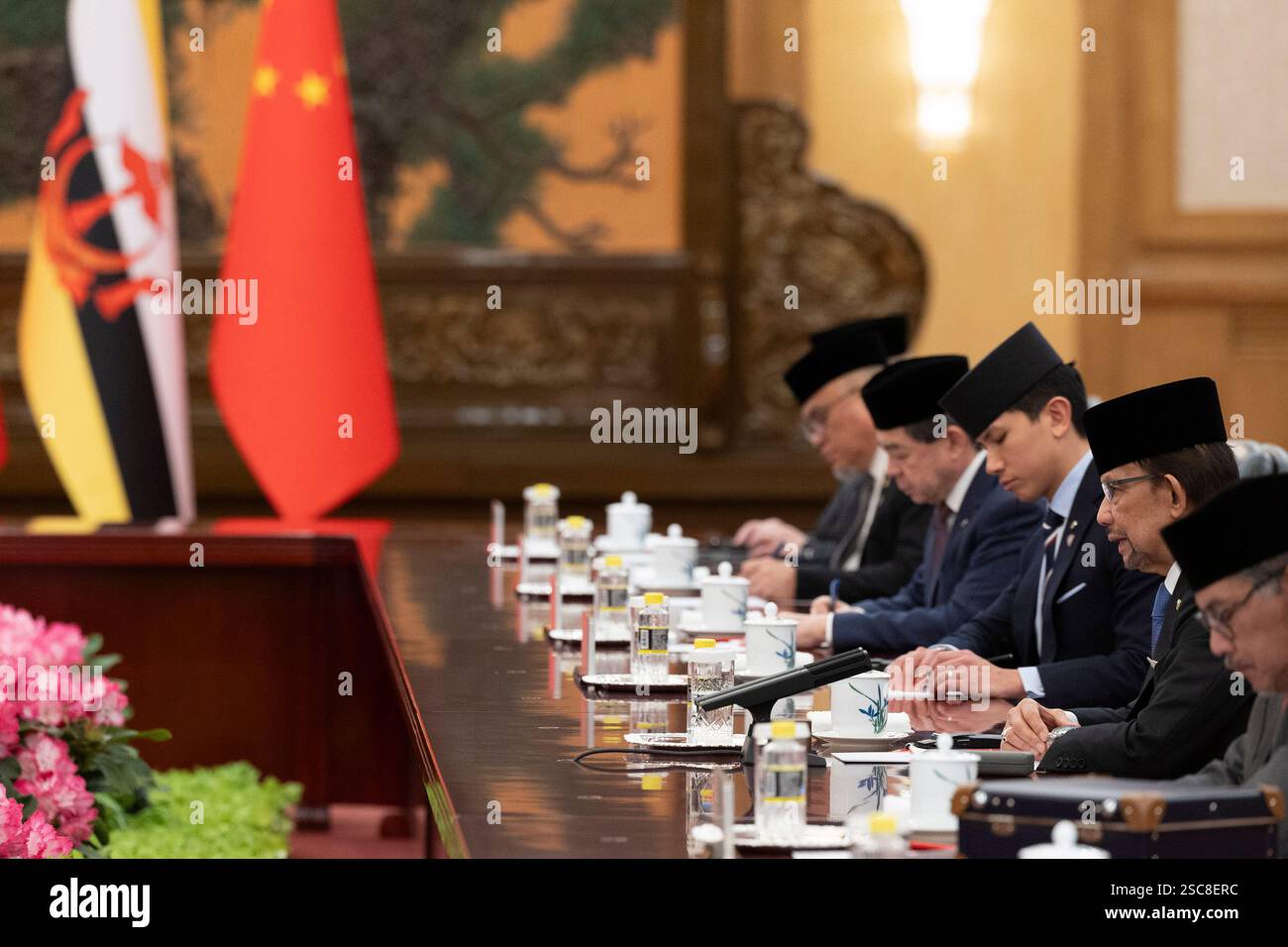 Brunei's Sultan Hassanal Bolkiah, second right, speaks during a meeting ...