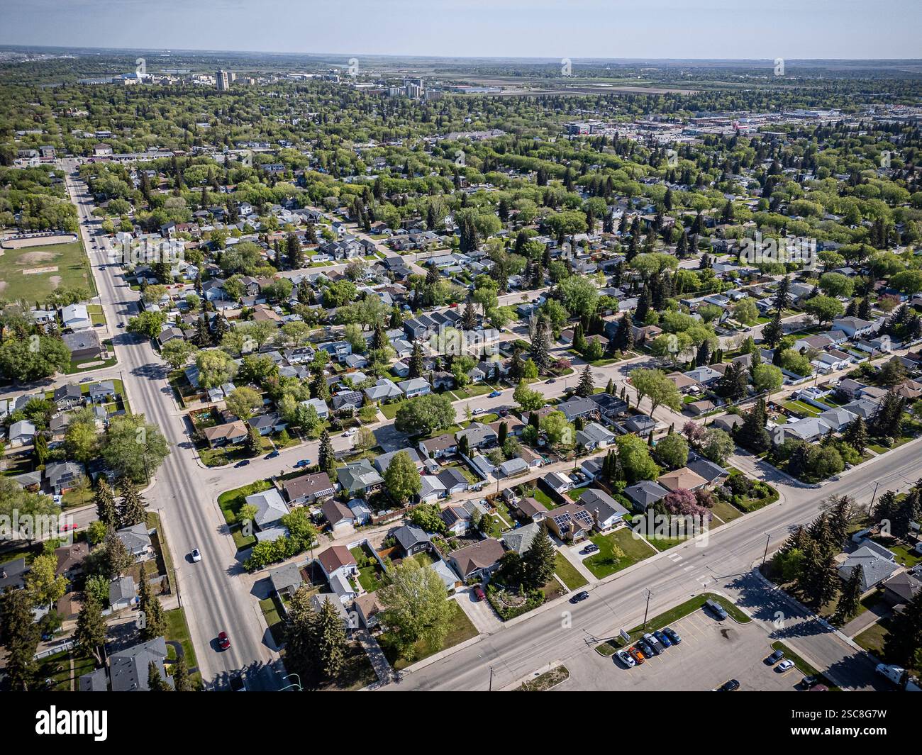 Residential neighborhood with houses and trees. The houses are mostly ...
