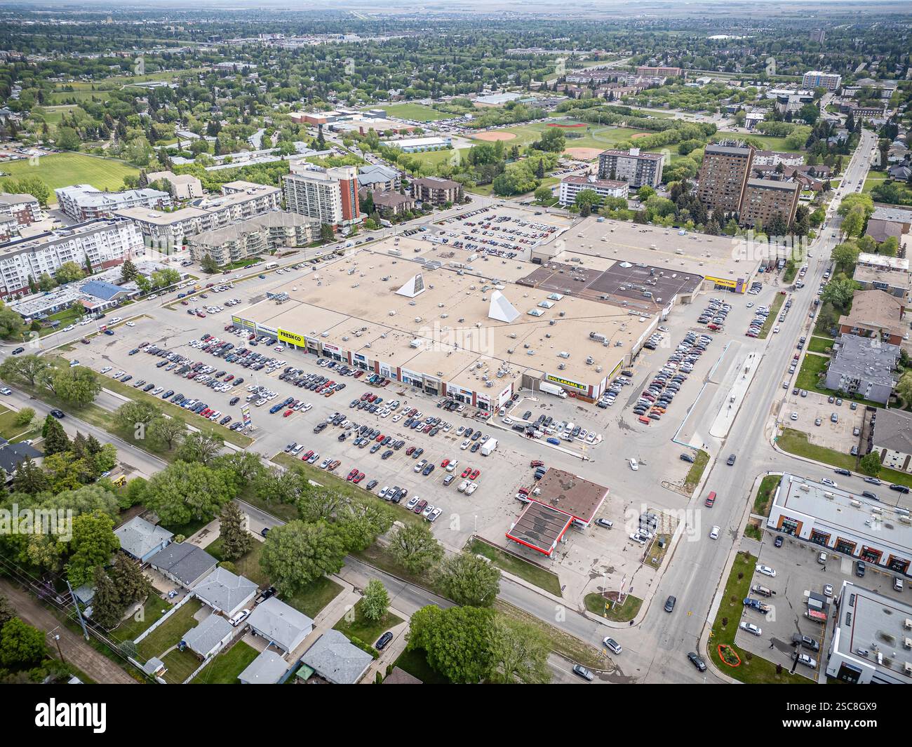 Large parking lot with a lot of cars and a few people. The parking lot ...