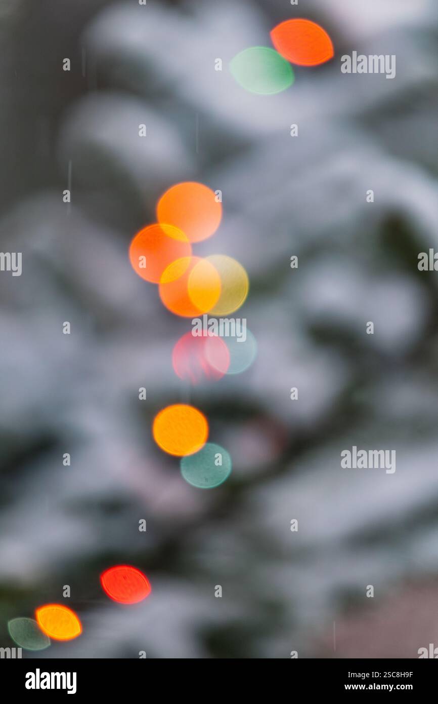 Colorful bokeh lights sparkle softly against the backdrop of a ...