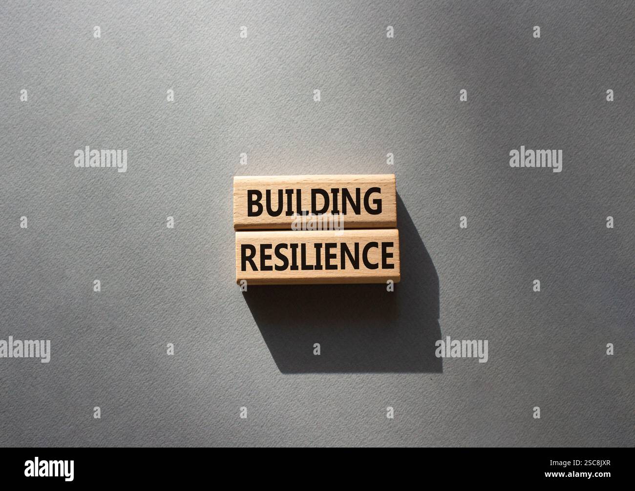 Building resilience symbol. Wooden blocks with words Building ...