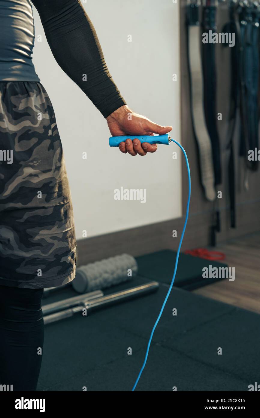 Skipping rope workout session in a gym with focus on fitness and ...
