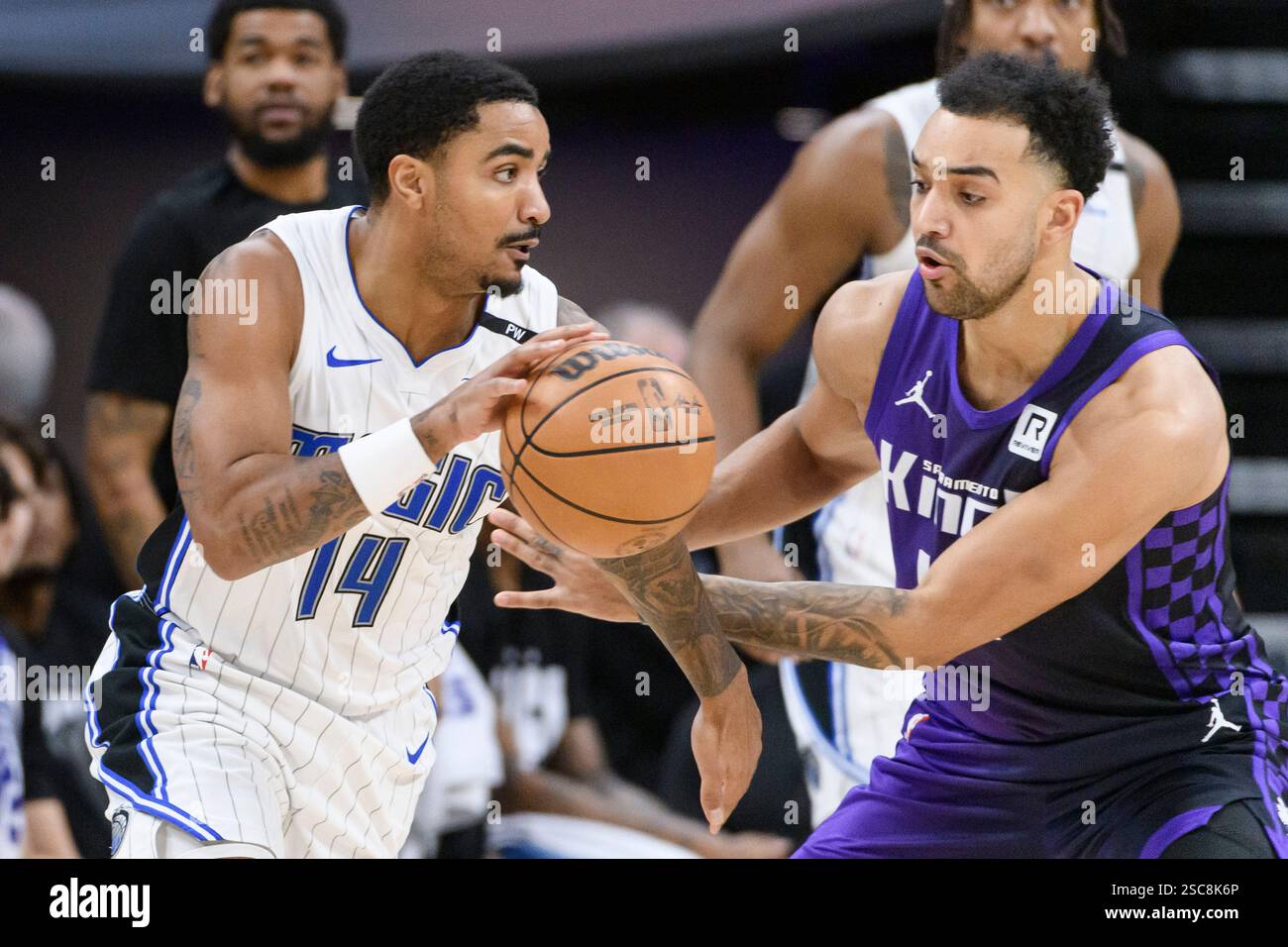 Orlando Magic guard Gary Harris (14) is guarded by Sacramento Kings ...