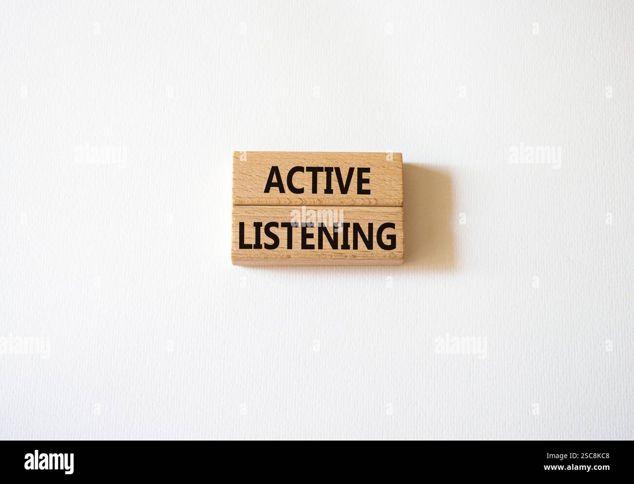 Active listening symbol. Wooden blocks with words Active listening ...