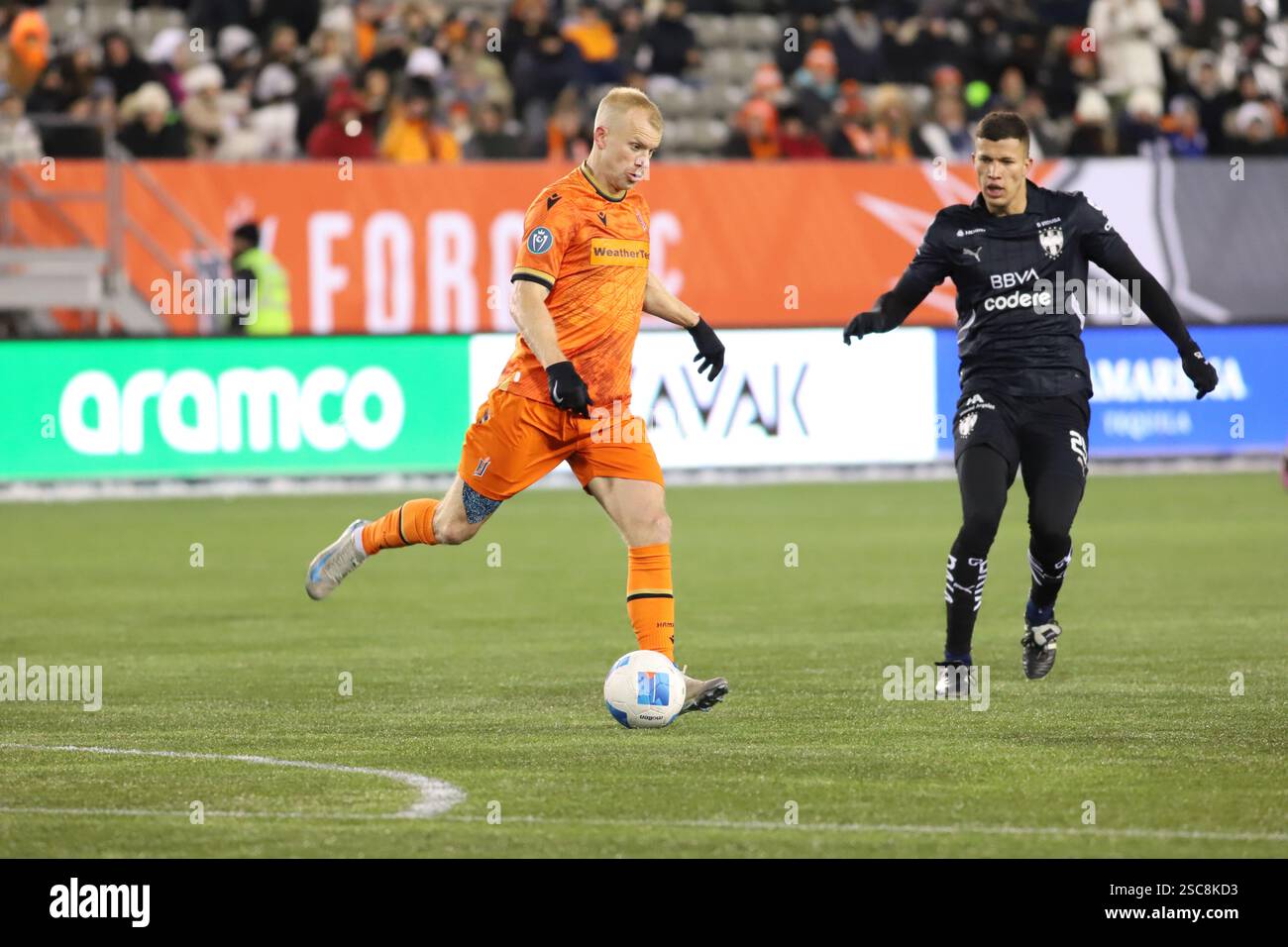 Kyle Bekke #10 of Forge FC drives the ball forward against Monterrey FC ...