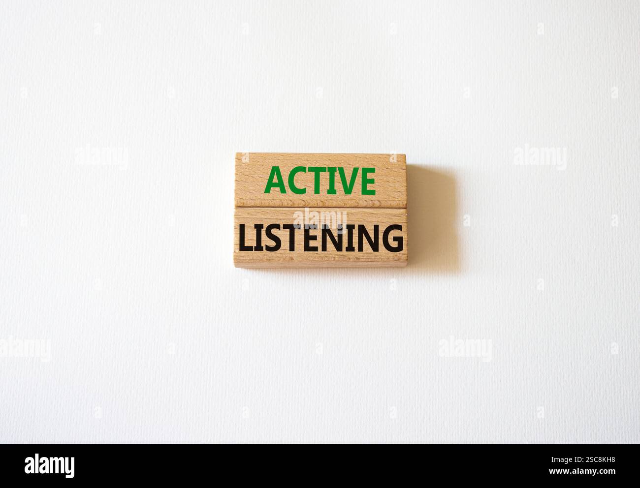 Active listening symbol. Wooden blocks with words Active listening ...