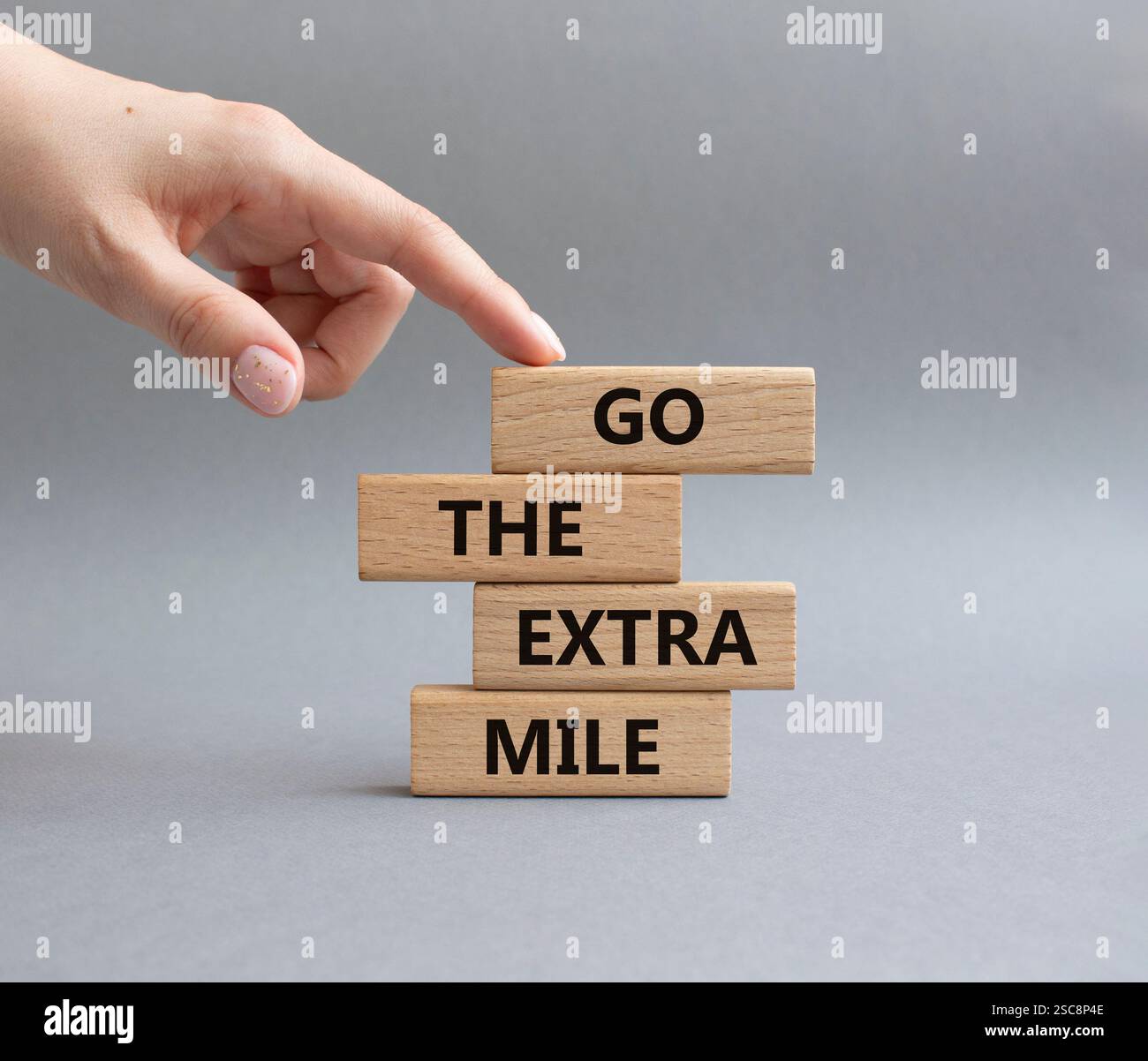 Go the extra mile symbol. Wooden blocks with words Go the extra mile ...