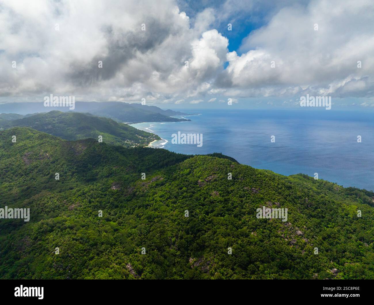 Aerial view of Coast of Mahe island with rainforest and blue ocean ...