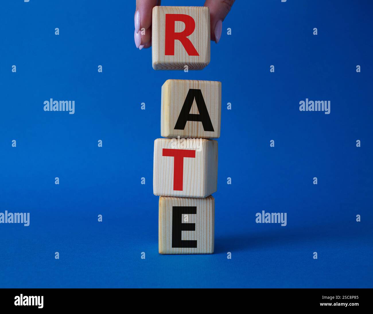 Rate symbol. Concept word Rate on wooden cubes. Businessman hand ...