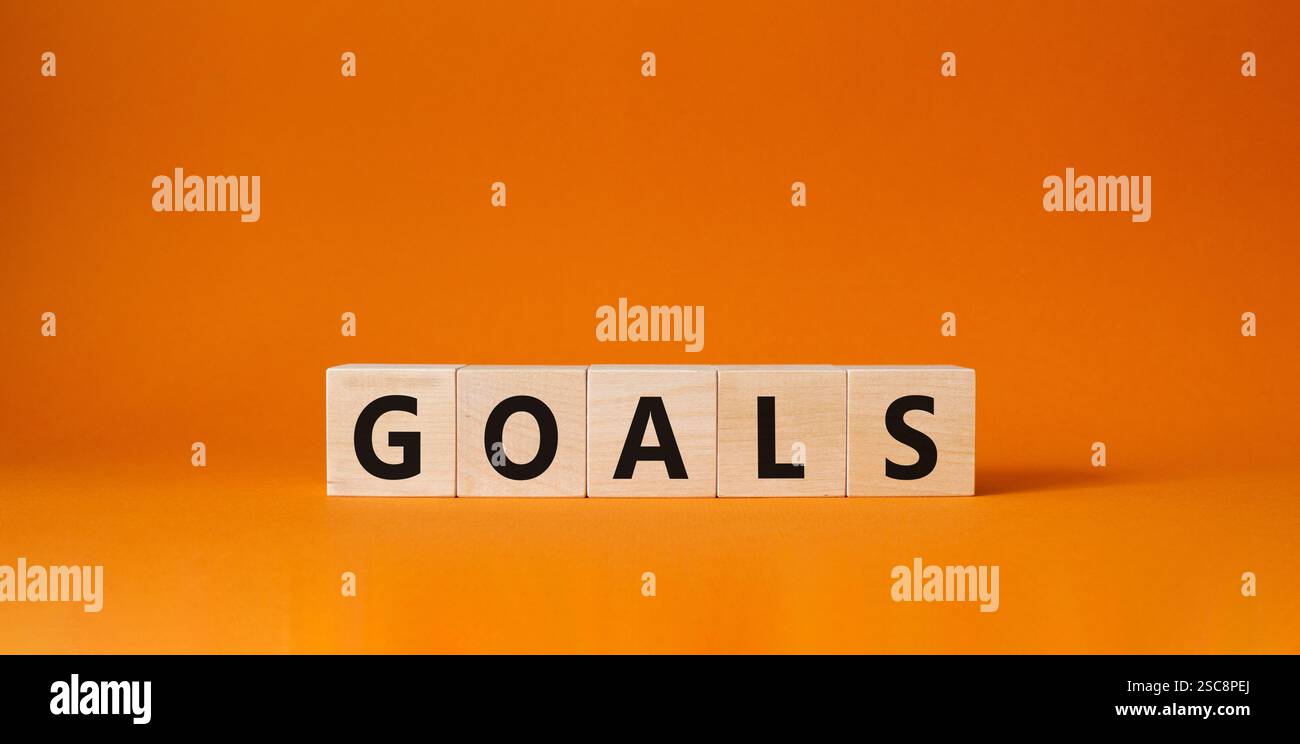 Goals symbol. Concept word Goals on wooden cubes. Beautiful orange ...