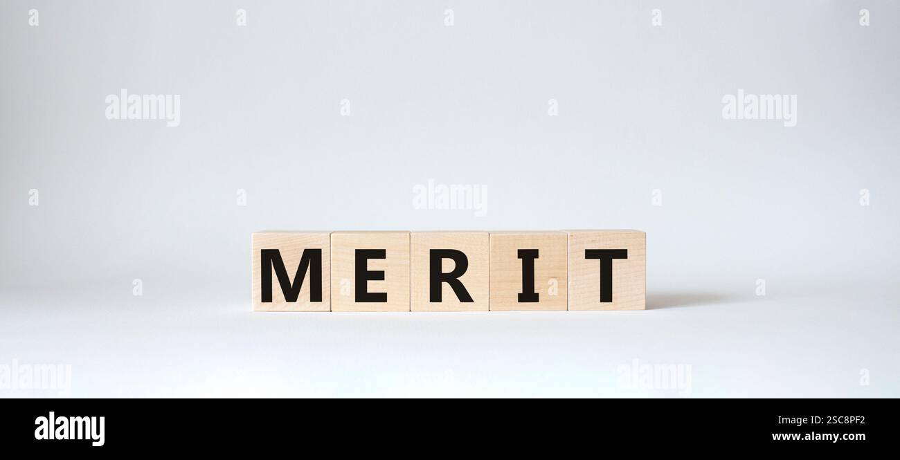 Merit symbol. Concept word Merit on wooden cubes. Beautiful white ...
