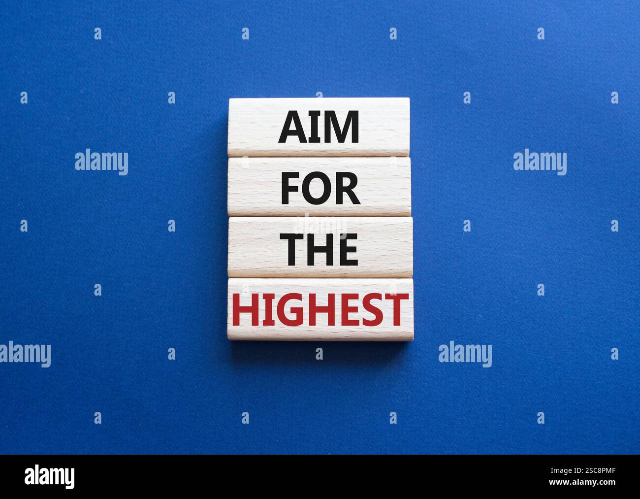 Aim for the Highest symbol. Concept words Aim for the Highest on wooden ...