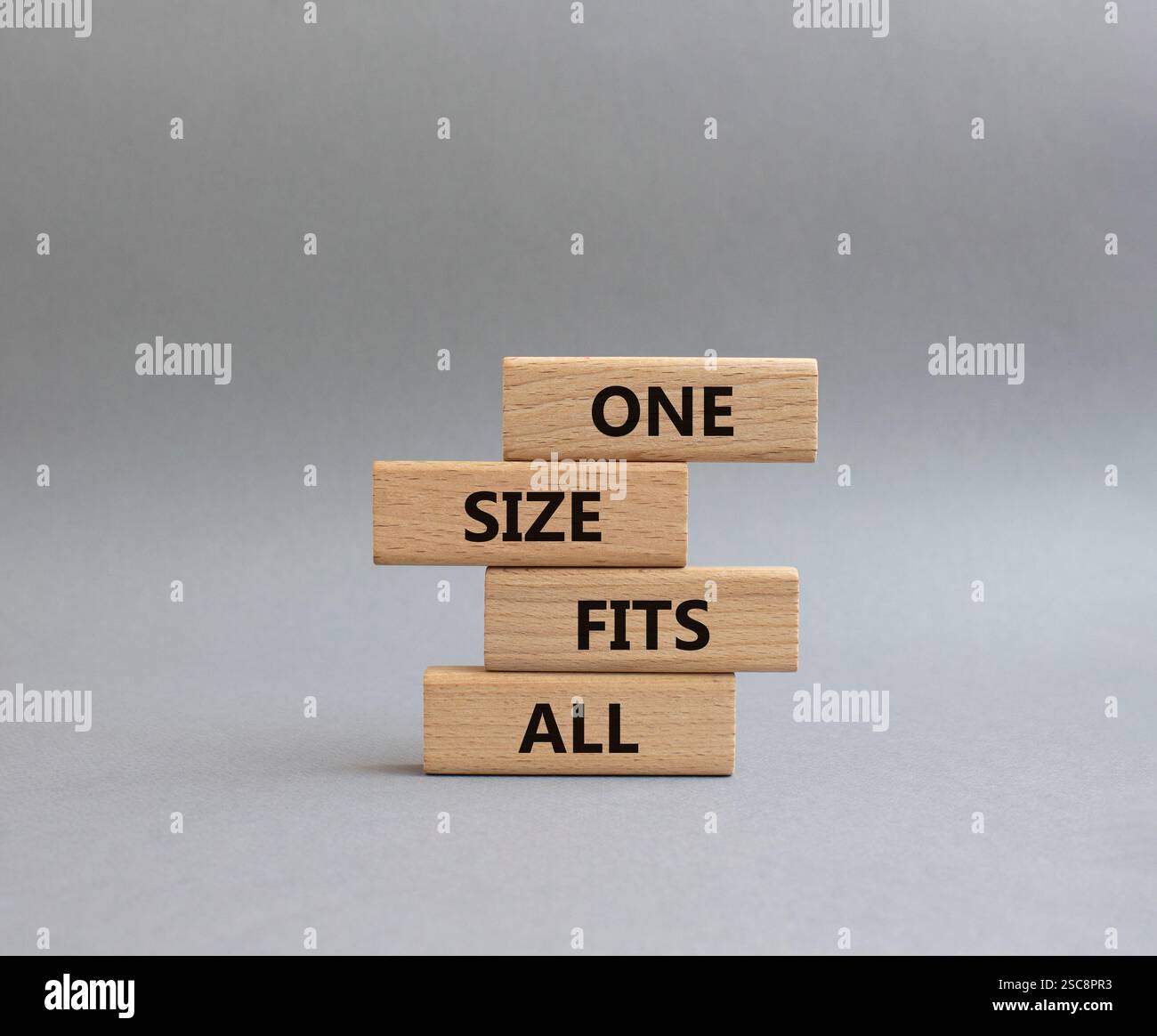 One size fits all symbol. Concept words One size fits all on wooden ...
