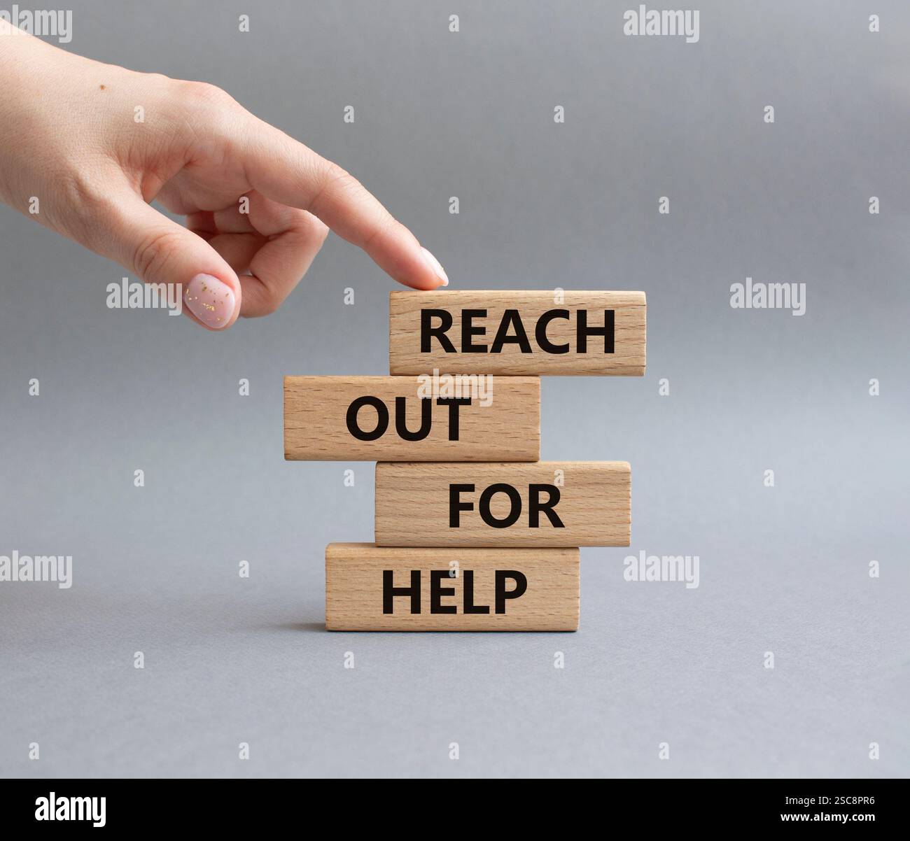 Reach out for help symbol. Wooden blocks with words Reach out for help ...