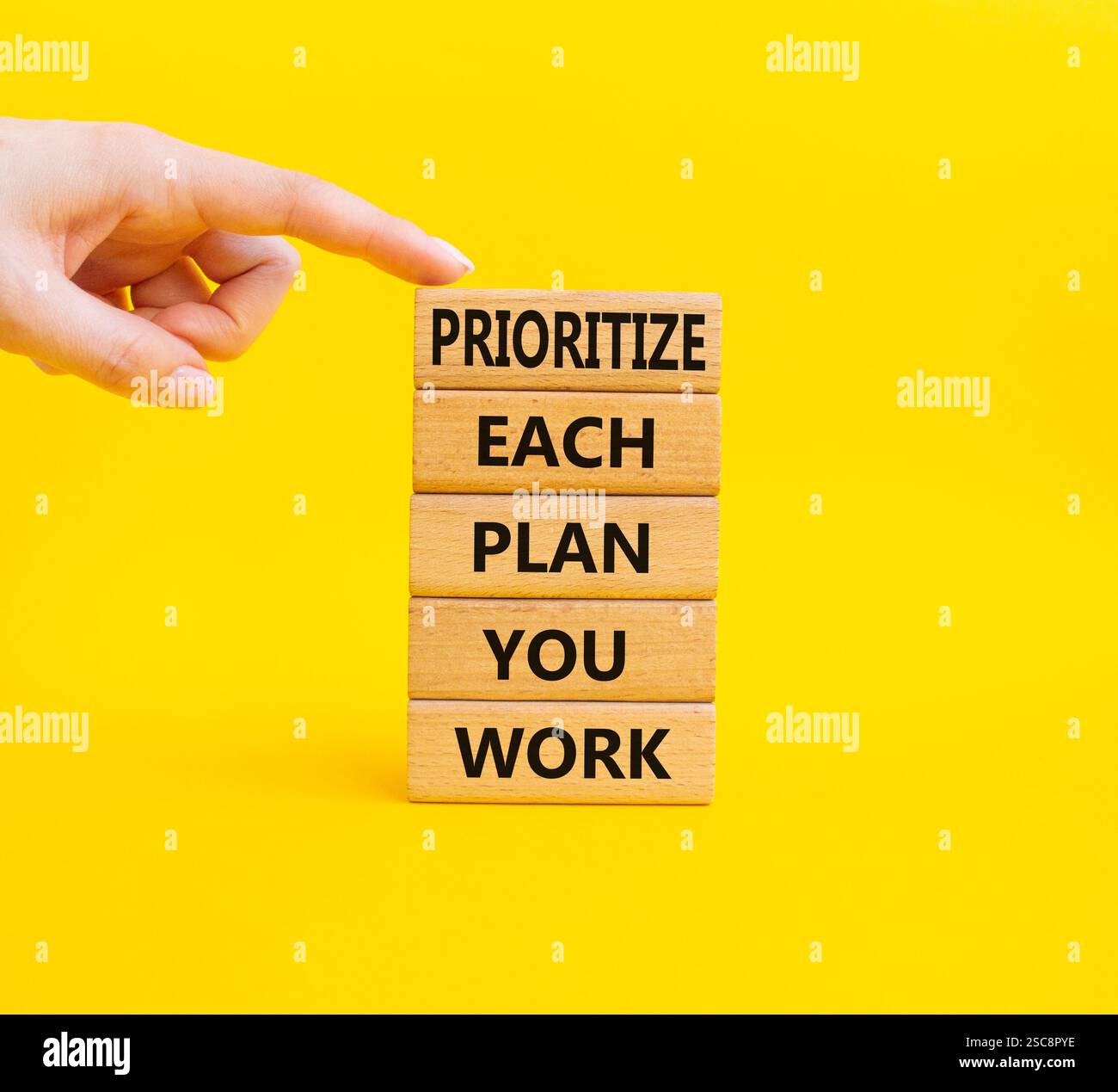 Priority, plan and work symbol. Wooden blocks with words Prioritize ...