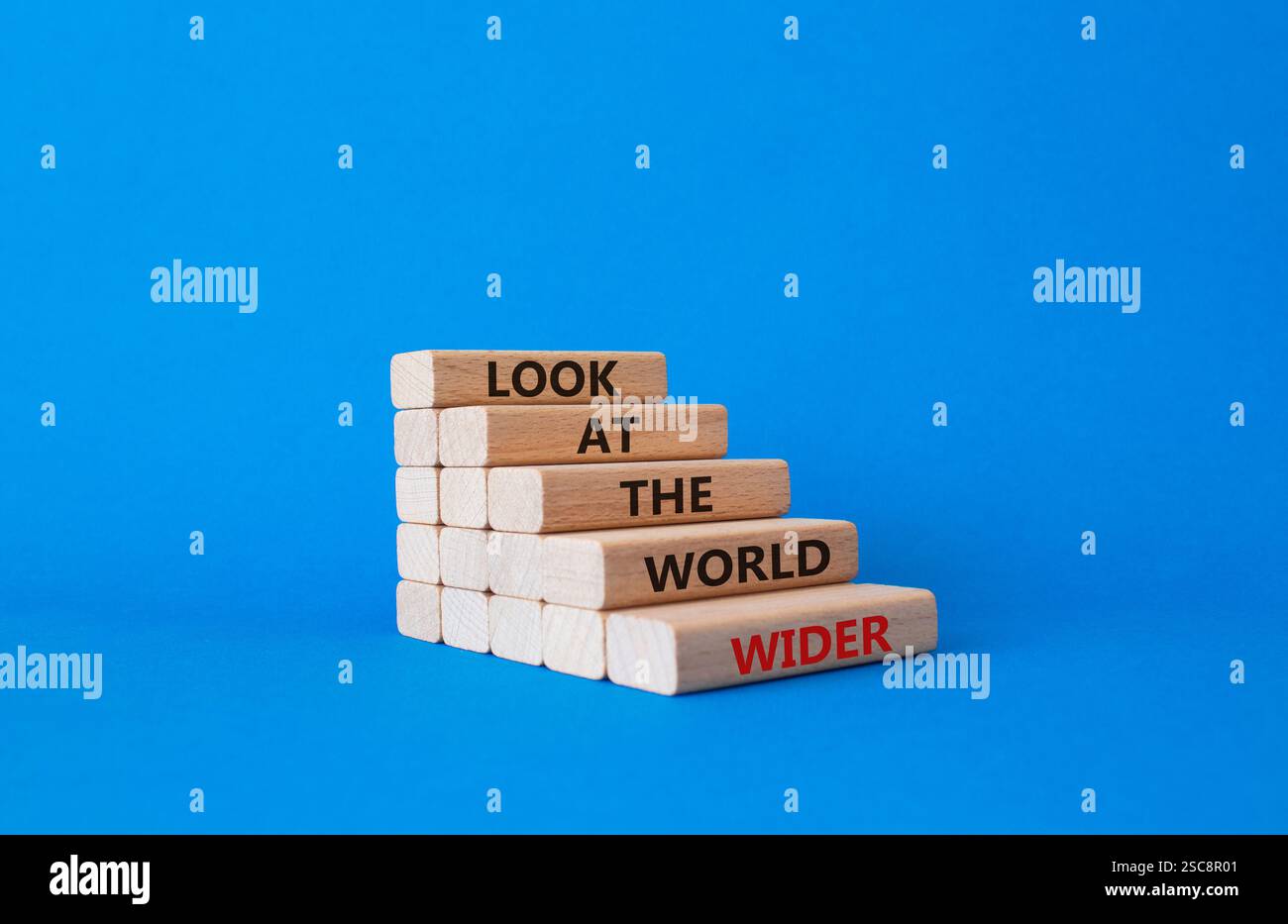 Look at the world wider symbol. Wooden blocks with words Look at the ...