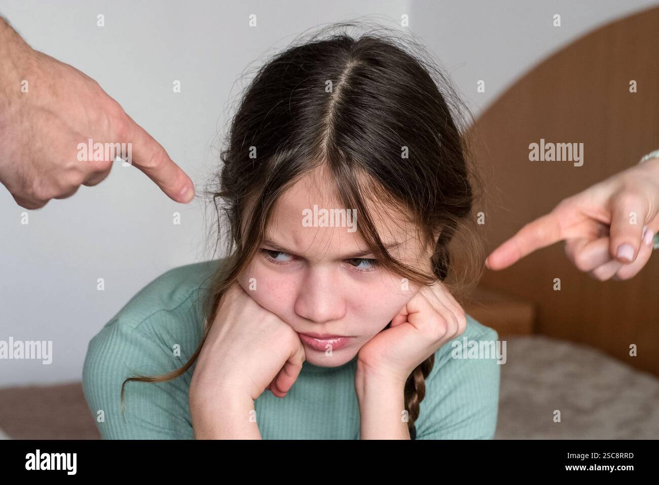Parents scolding little girl at home. Sad child ignoring them. Kid ...
