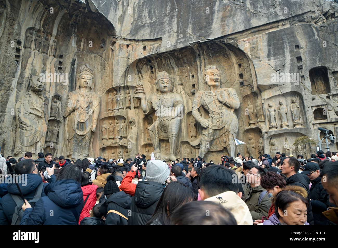 Luoyang, China. 06th Feb, 2025. Tourists visit the Longmen Grottoes, a ...