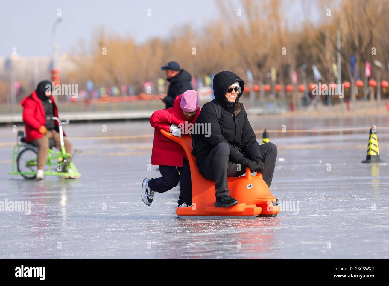 **CHINESE MAINLAND, HONG KONG, MACAU AND TAIWAN OUT** Visitors skate at ...