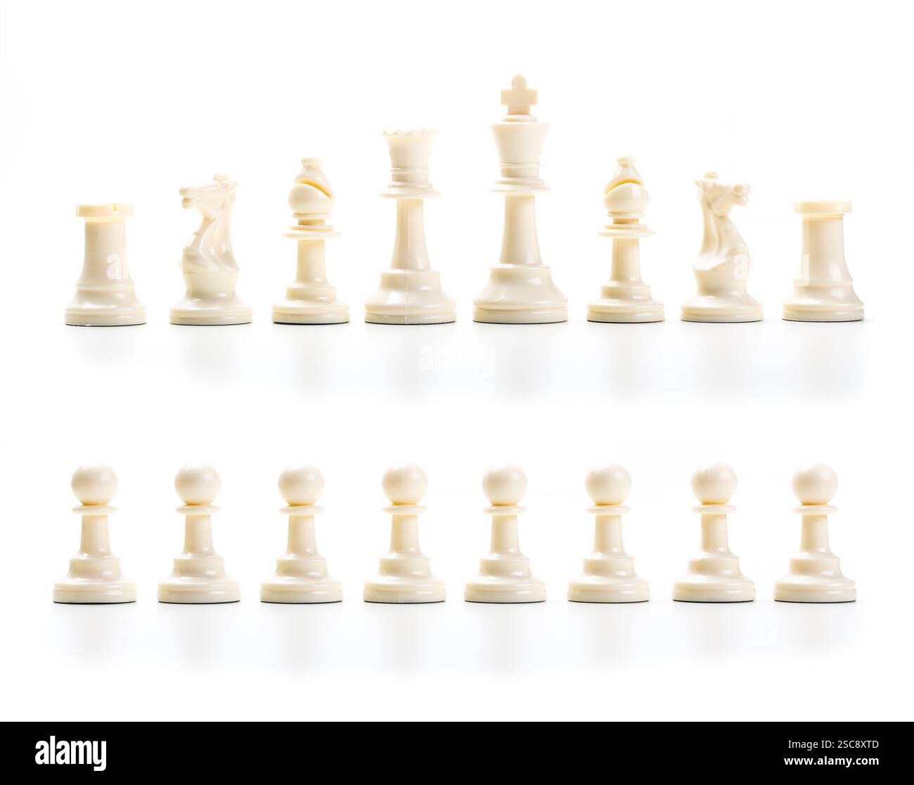 wooden chess set lined up in rows isolated Stock Photo - Alamy
