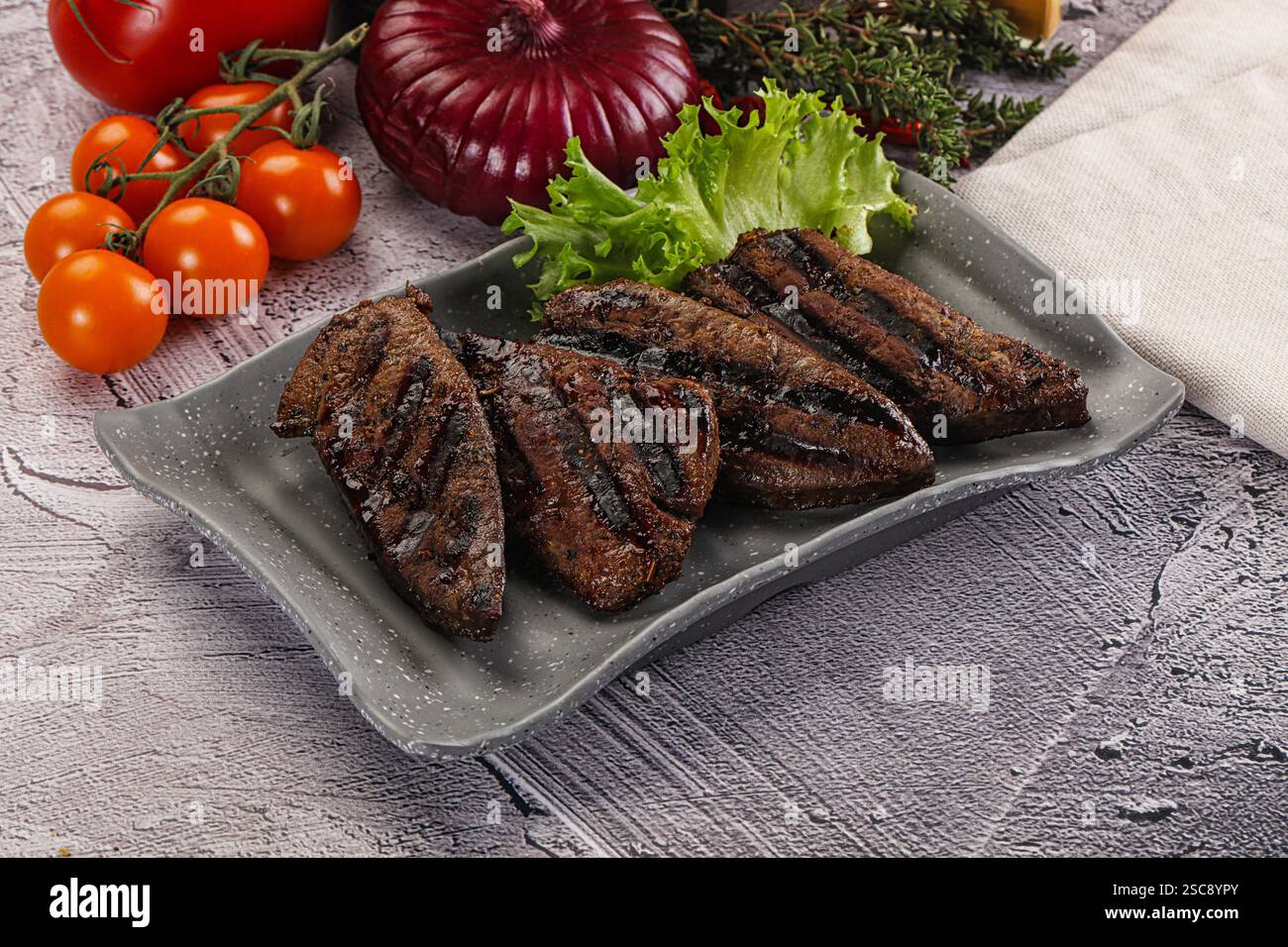 Grilled diet beef liver steak in the plate Stock Photo - Alamy