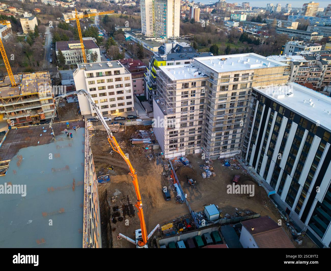 Aerial view of a construction site with a high-rise building under ...