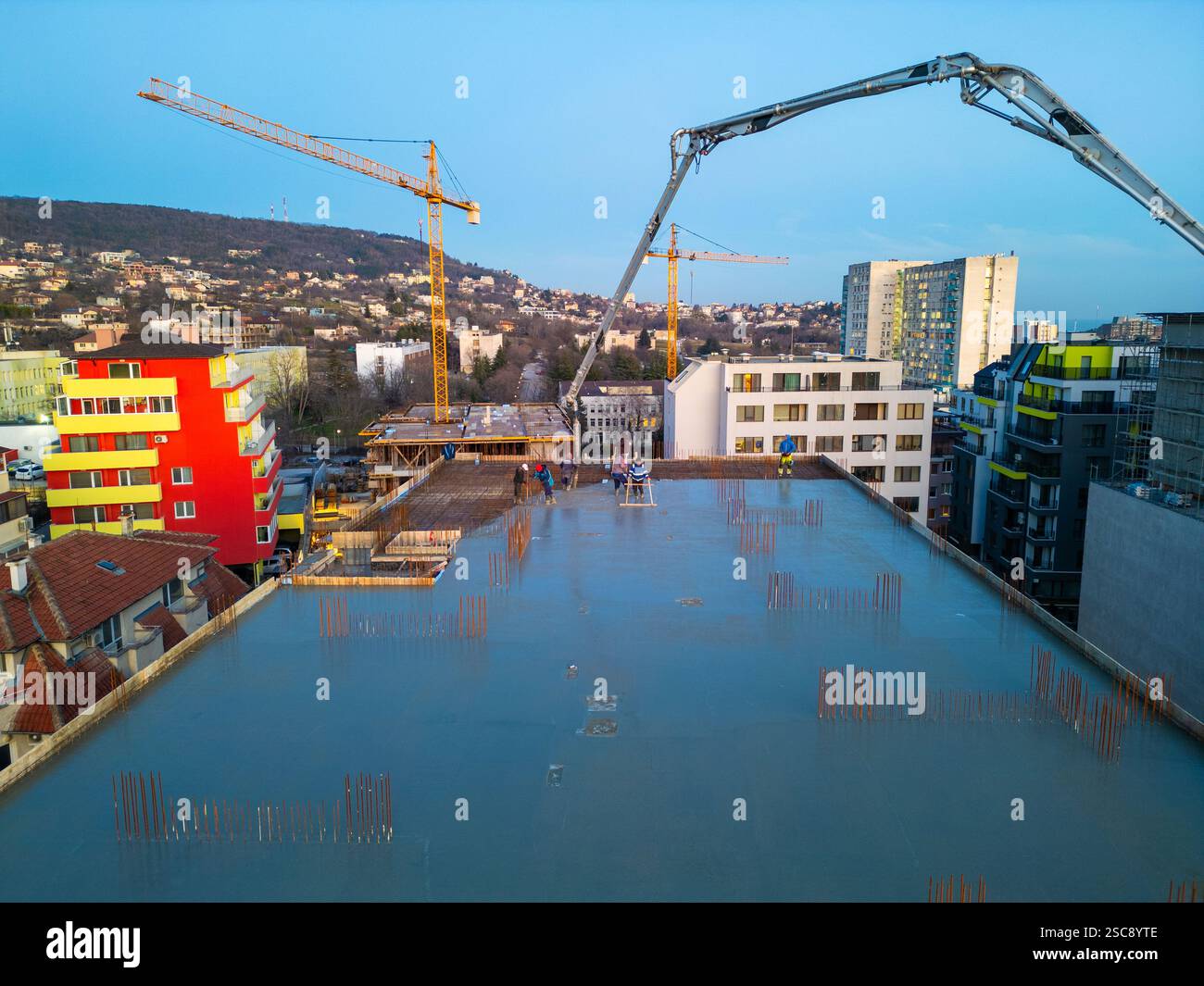 Aerial view of a construction site with a high-rise building under ...