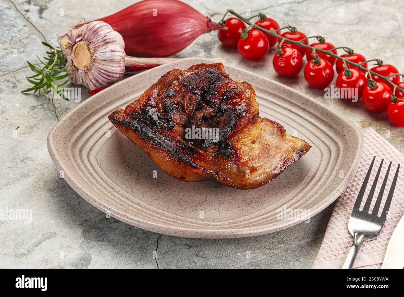 Roasted pork knuckle steak with bone Stock Photo - Alamy