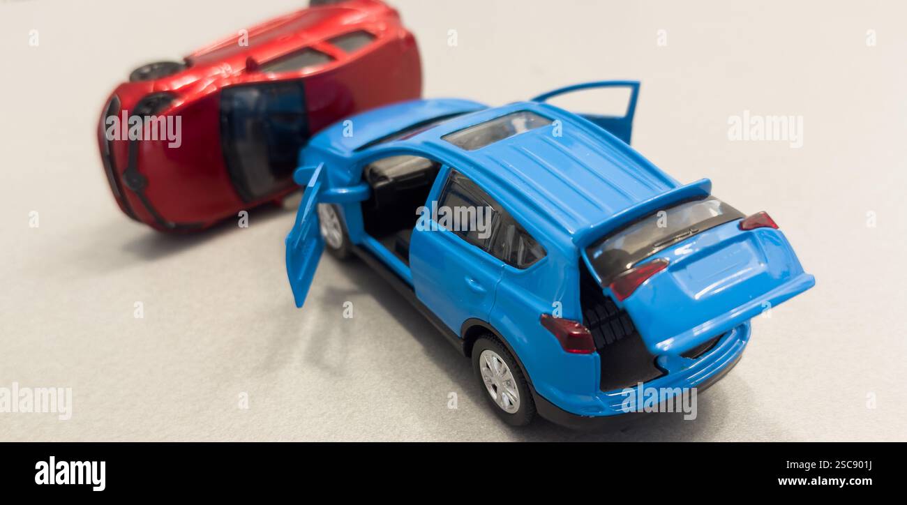 Two mini toy car crash on white background, incident, car traffic ...