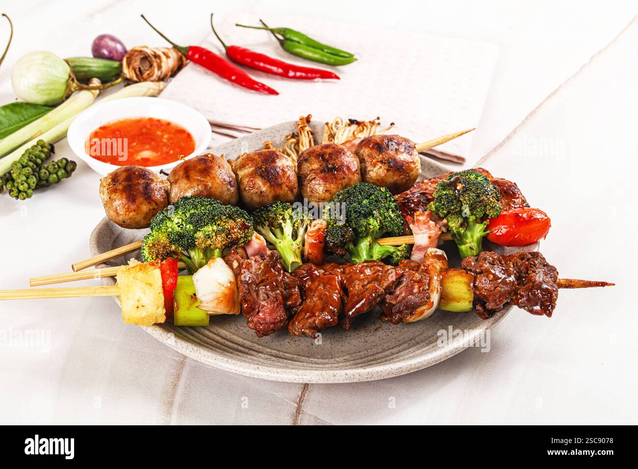 Asian grilled skewer assortment satay with beef, porl, chicken and ...