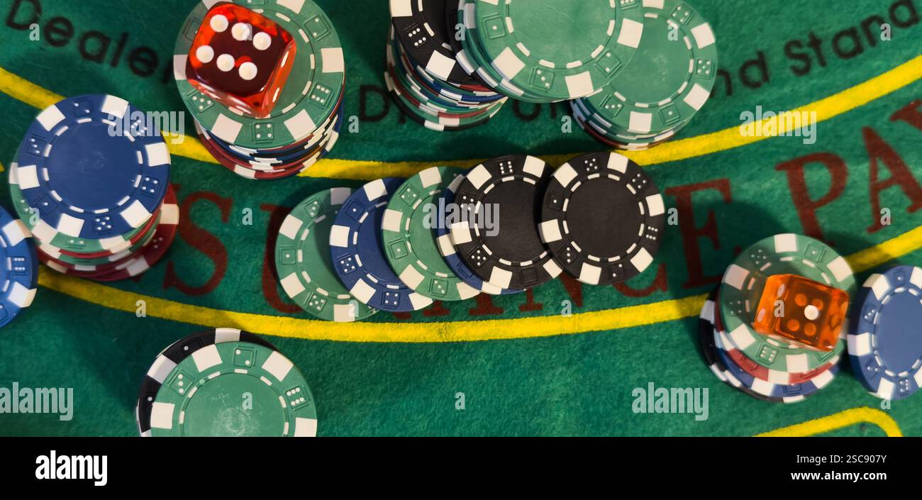 Poker Chips on a gaming table with dramatic lighting Stock Photo - Alamy