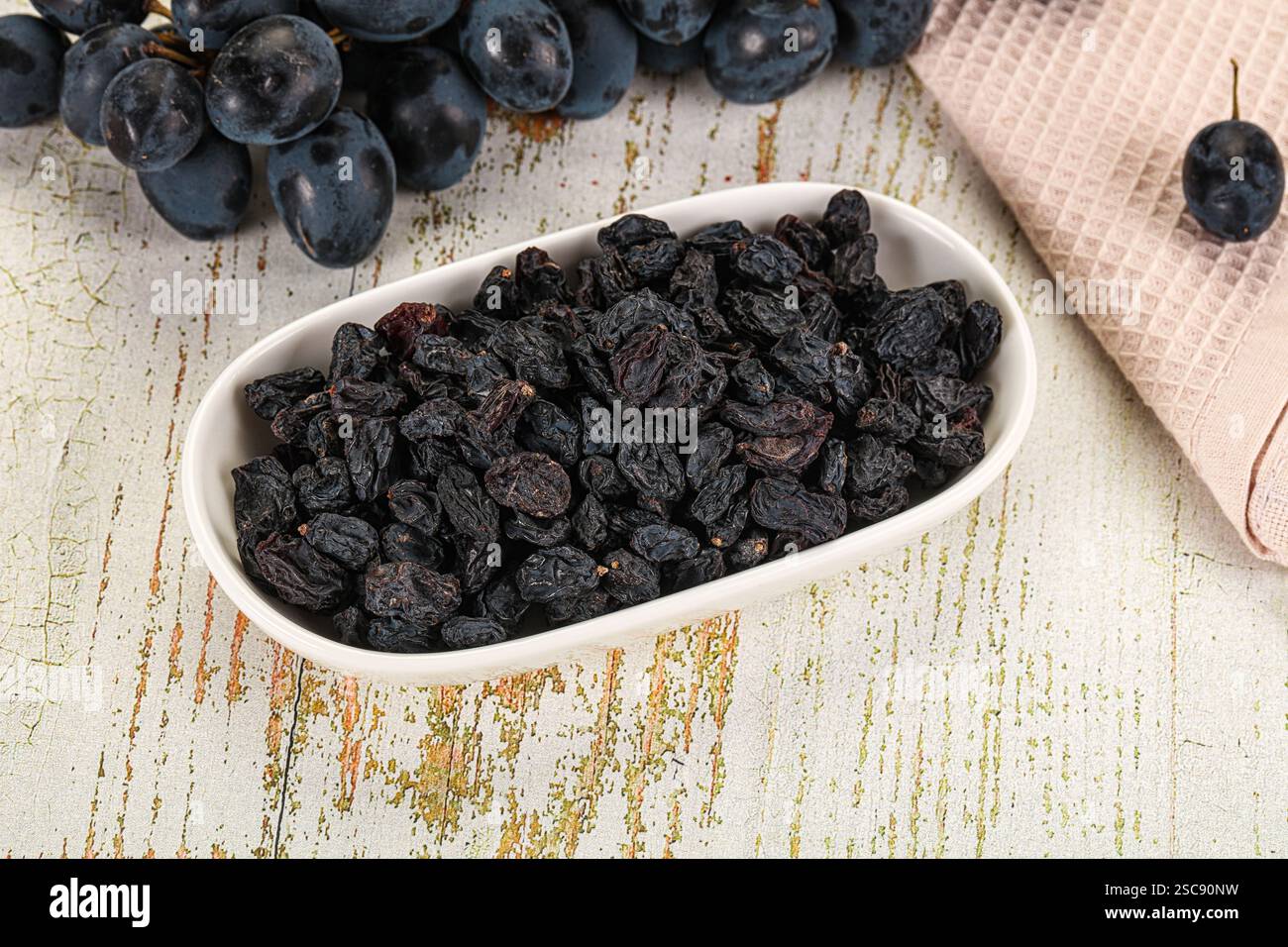 Dry ripe sweet blue raisin heap Stock Photo - Alamy