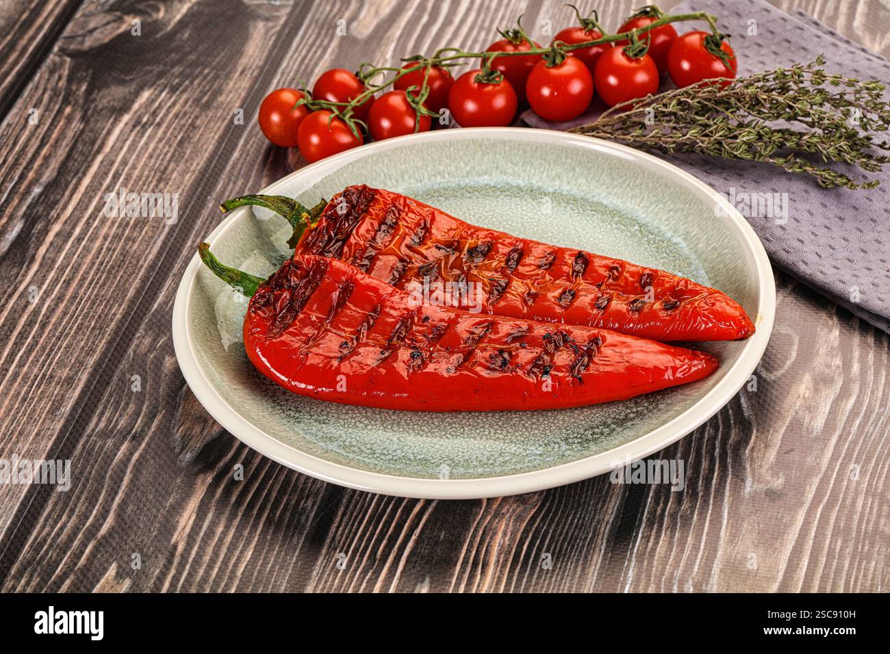 Grilled whole red paprika ramiro pepper Stock Photo - Alamy