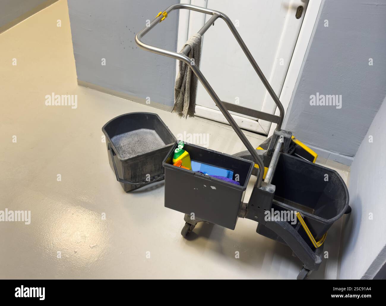 Cleaning tools cart wait for cleaning. Bucket and set of cleaning ...