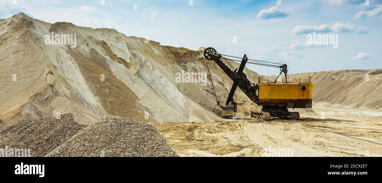 Old yellow dredge in sandy to career Stock Photo - Alamy