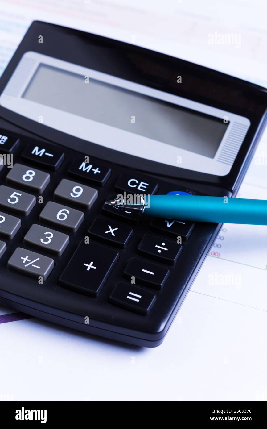 Graphs and Calculator Stock Photo - Alamy