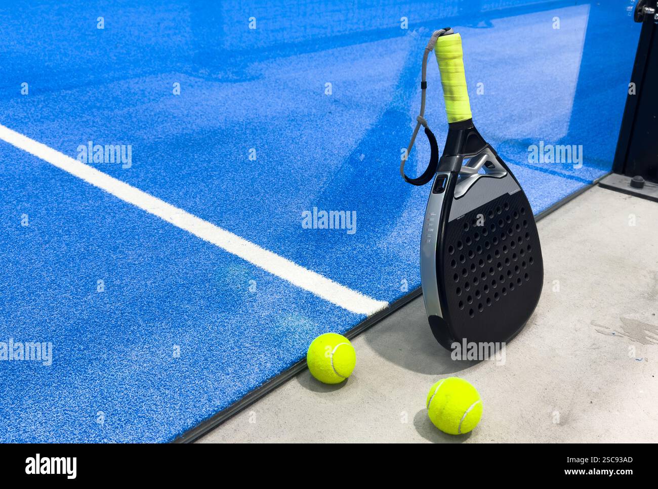padel racket on a padel court with a ball Stock Photo - Alamy
