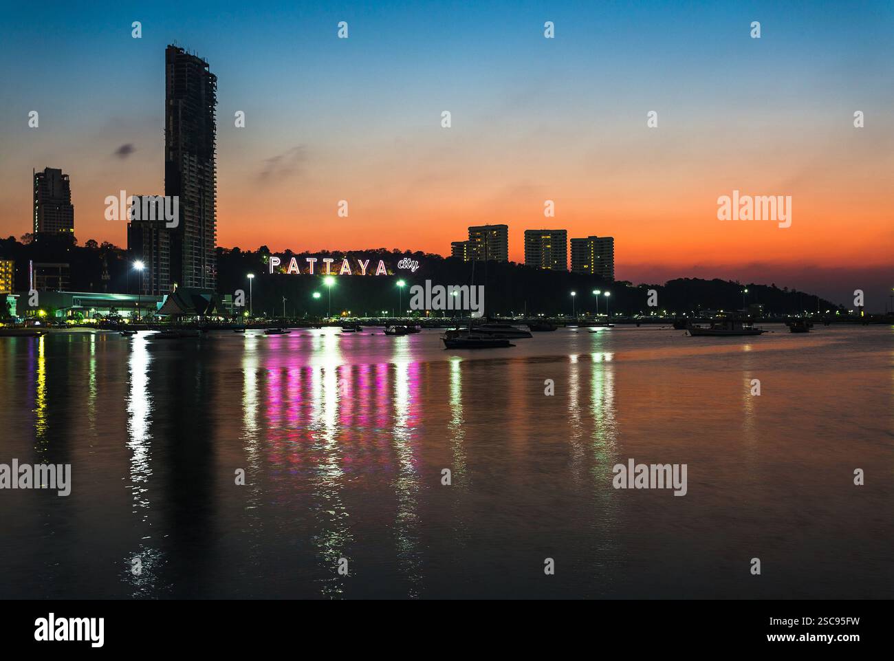 The Pattaya city harbor at twilight, Thailand Stock Photo - Alamy