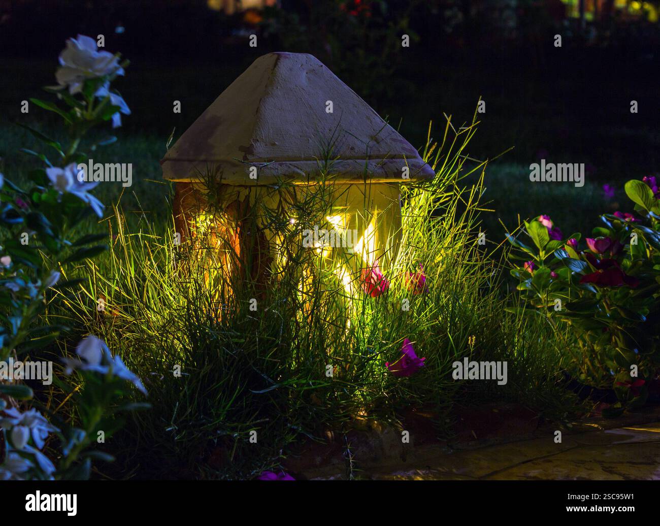 Small ceramic Garden Lamp on surrounded grass field Stock Photo - Alamy